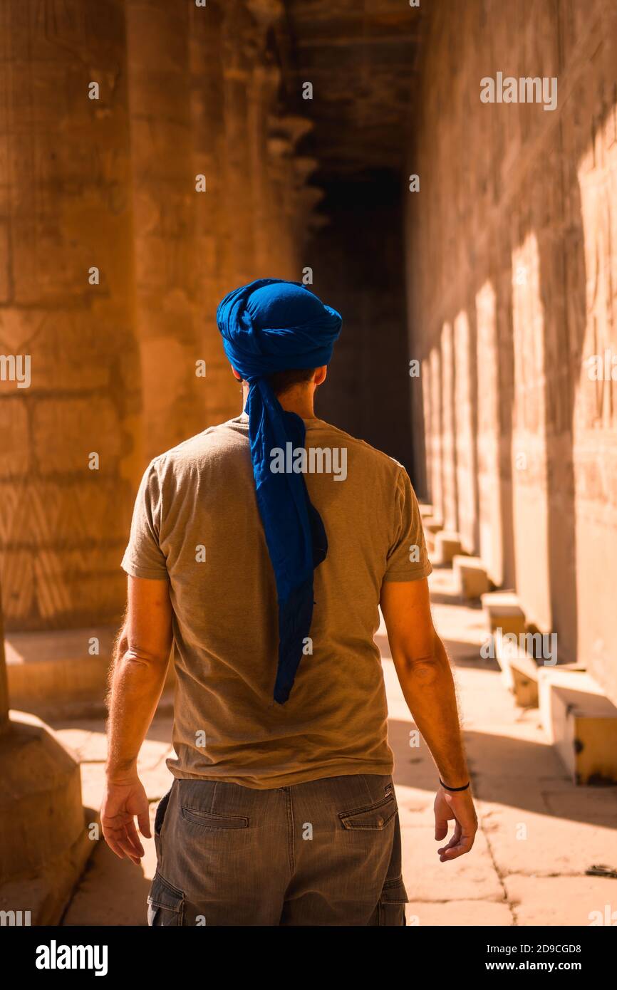 Shallow focus of a male wearing a blue Turban and walking around The ...