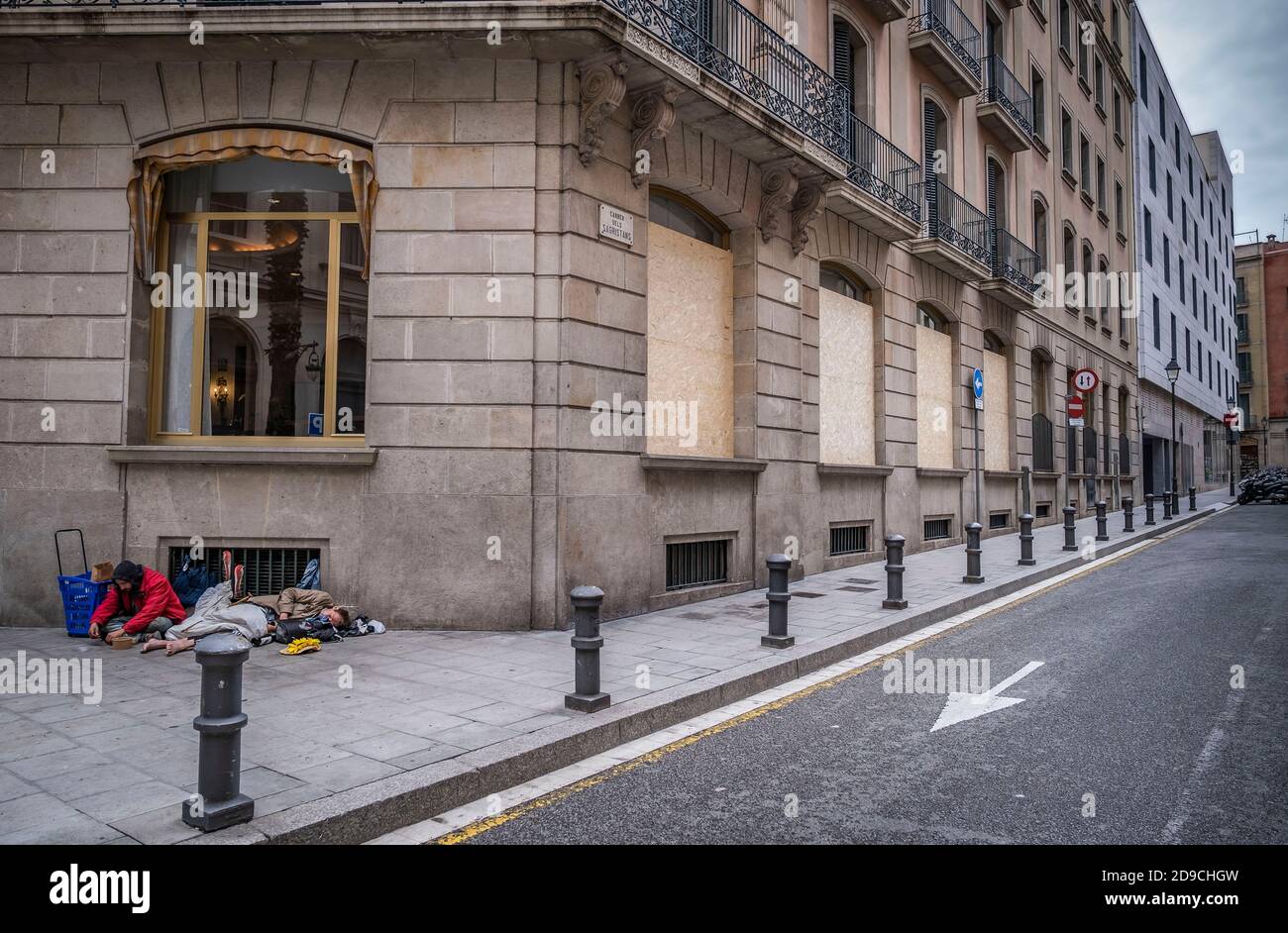 Two beggars seen under the windows of the Hotel Colón during the crisis ...