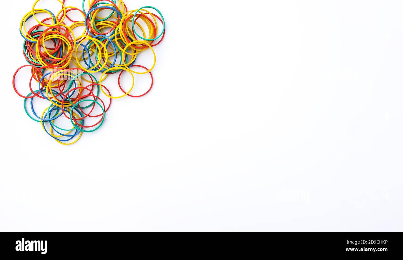 Bright colorful rubber bands on white background Stock Photo - Alamy