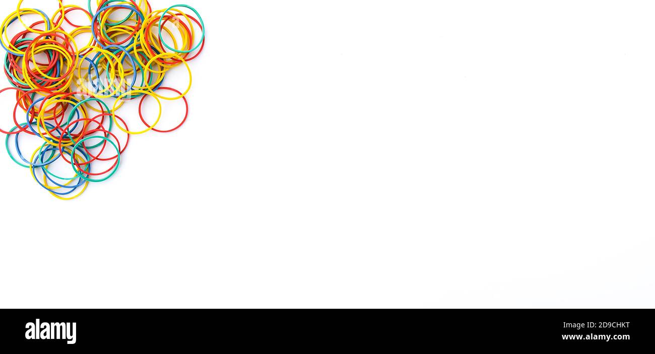 Bright colorful rubber bands on white background Stock Photo - Alamy