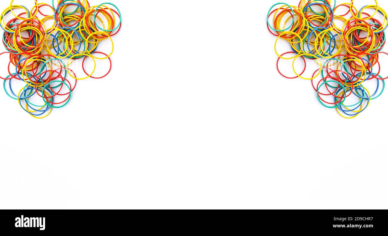 Bright colorful rubber bands on white. Symmetrical background Stock ...