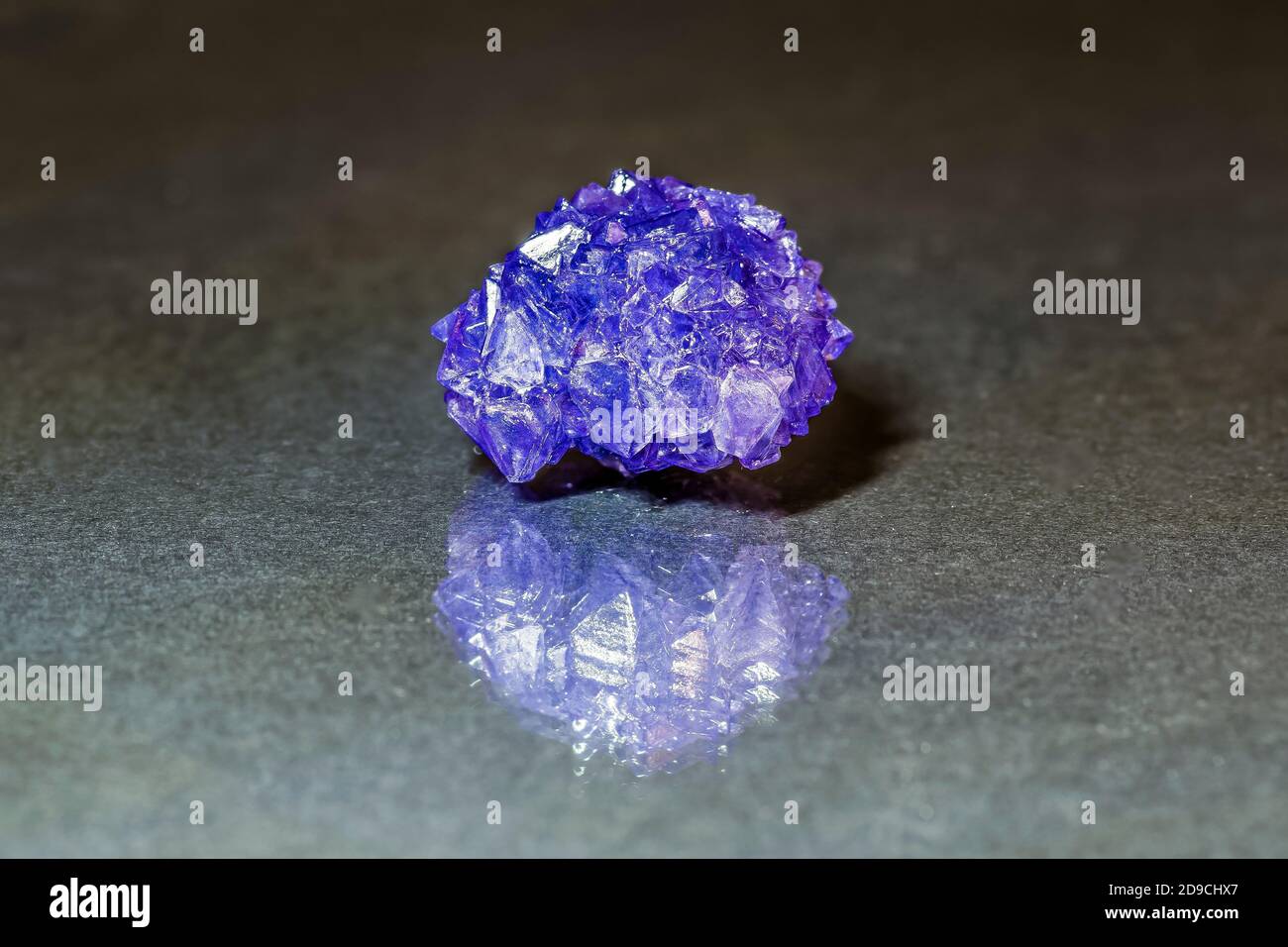 Closeup of a crystalline in a reflective material Stock Photo - Alamy