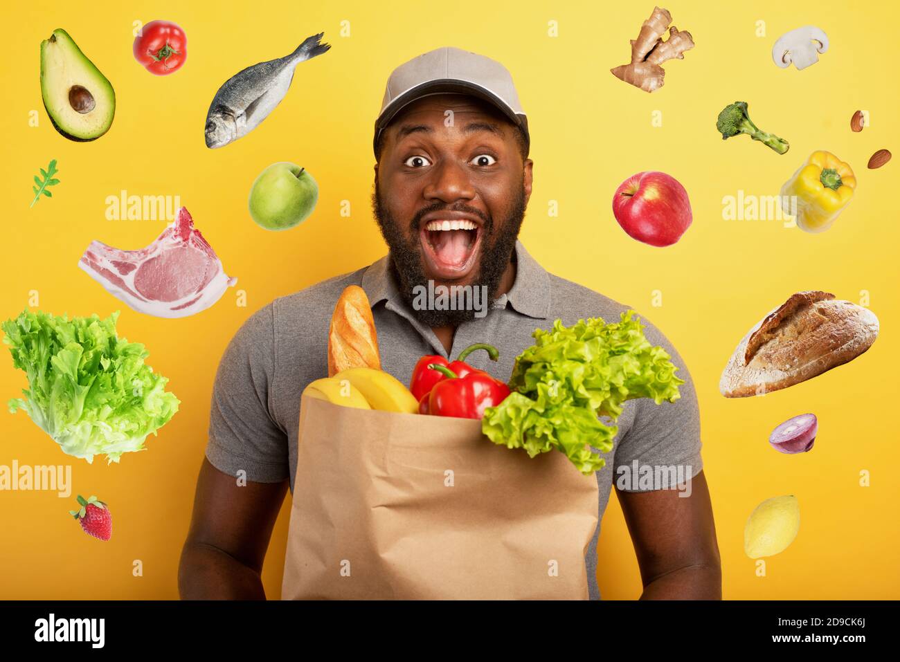 Deliveryman with happy expression ready to deliver bag with food ...