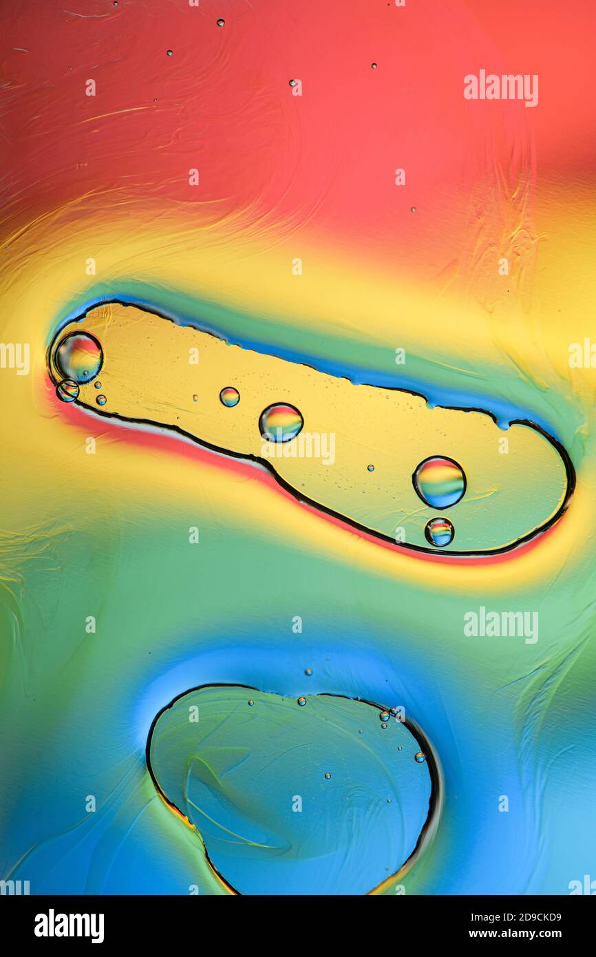 Abstract macro world. Beautiful refraction of rainbow light in liquid ...
