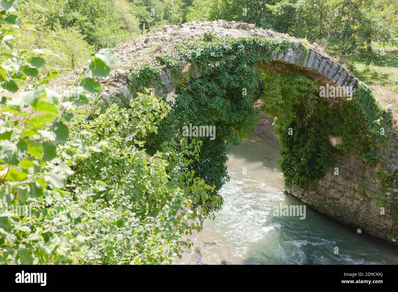 Ancient semicircular stone bridge Stock Photo - Alamy