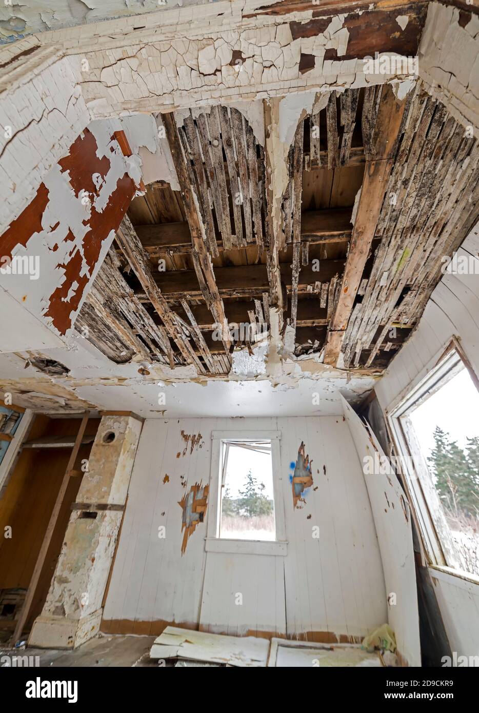 Inside an abandoned house. Walls falling apart. Ceiling damaged Stock ...