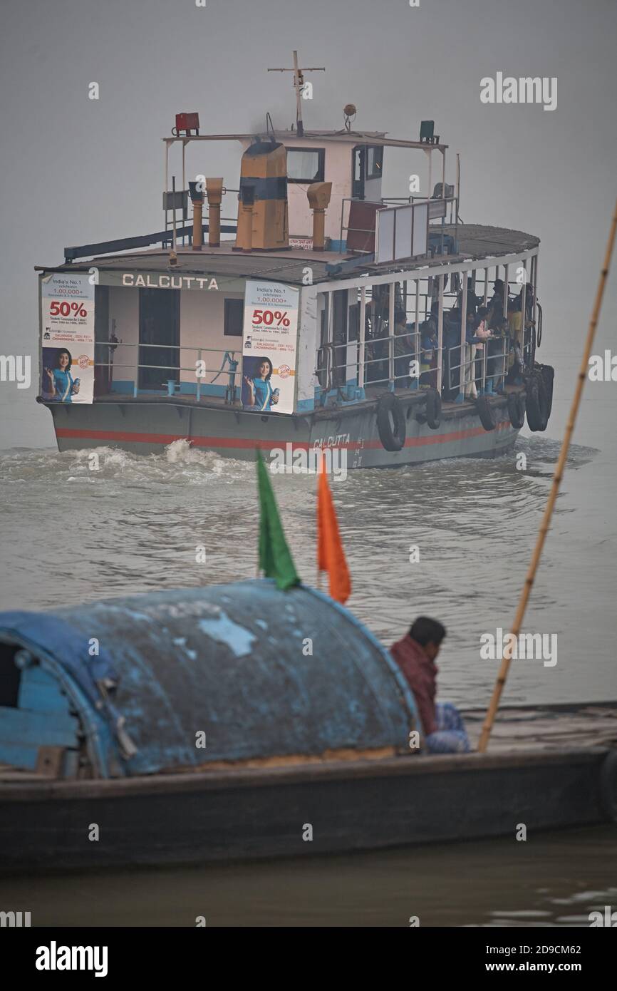 Kolkata, India, January 2008. A passenger ferry at sunset on the Ganges ...