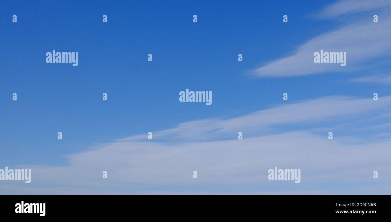 Blue spring sky with white clouds. Beautiful background Stock Photo - Alamy