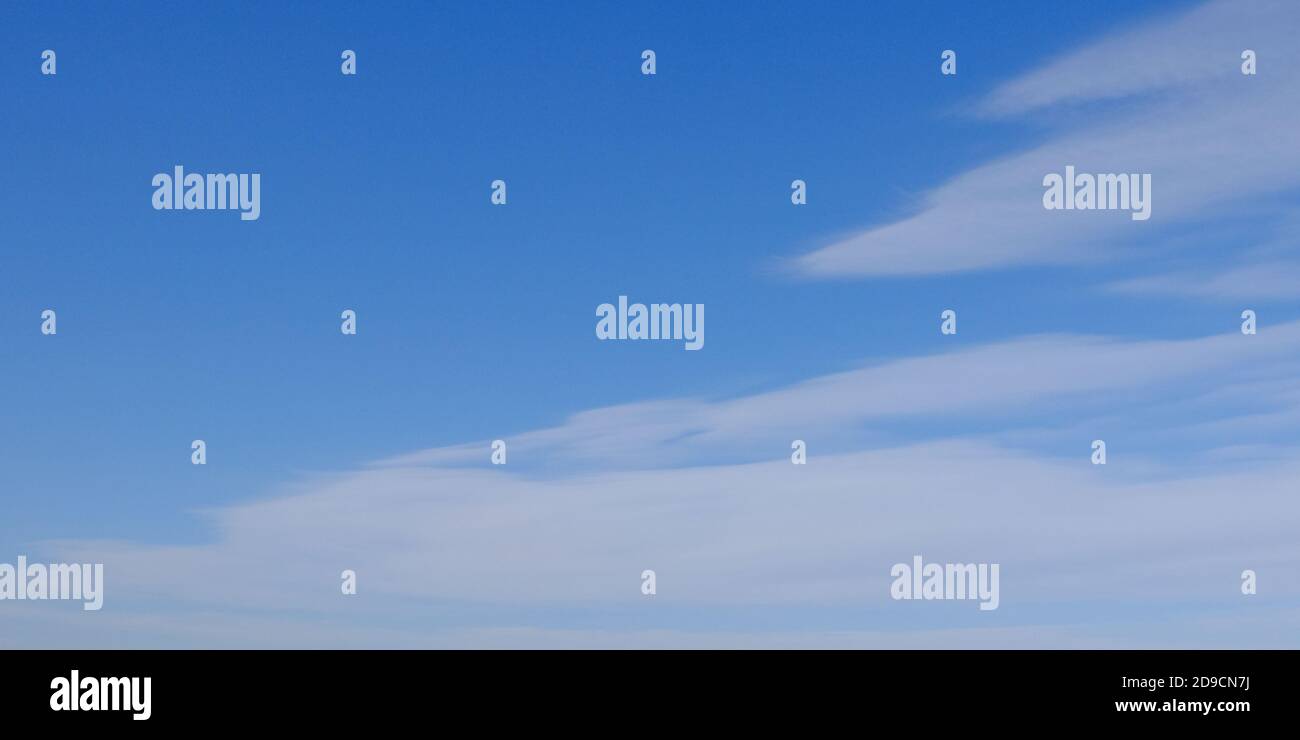Blue spring sky with white clouds. Beautiful background Stock Photo - Alamy
