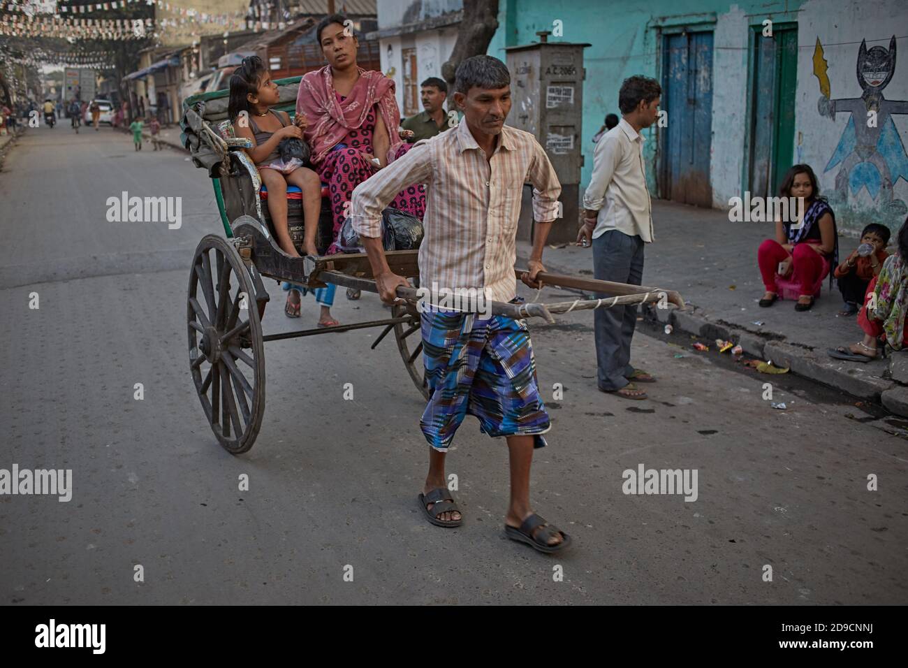 Hand rickshaw puller hi-res stock photography and images - Alamy