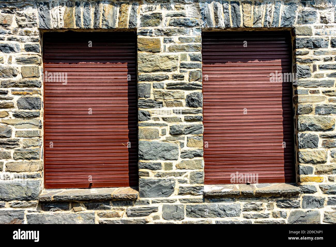 Closeup of windows with rolling shutters Stock Photo - Alamy