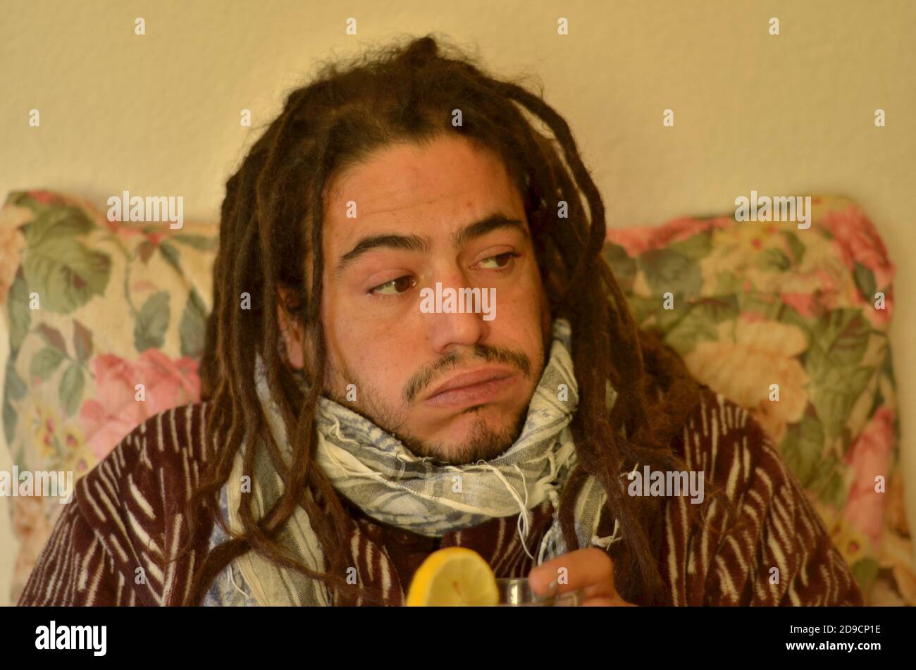 Spanish man drinking lemon tea while in self-isolation at his home on a ...