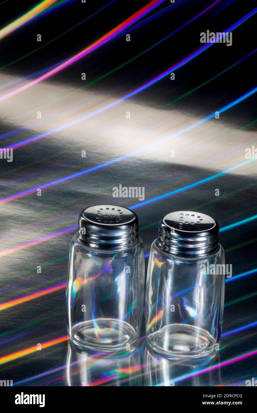 Photo of Empty Salt and Pepper Bottles on Rainbow Stripes Background ...