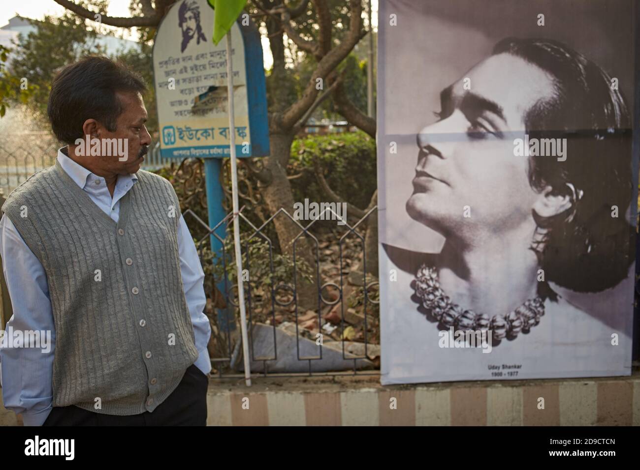 Kolkata, India, January 2016 A man looks at a photo of Indian dancer ...