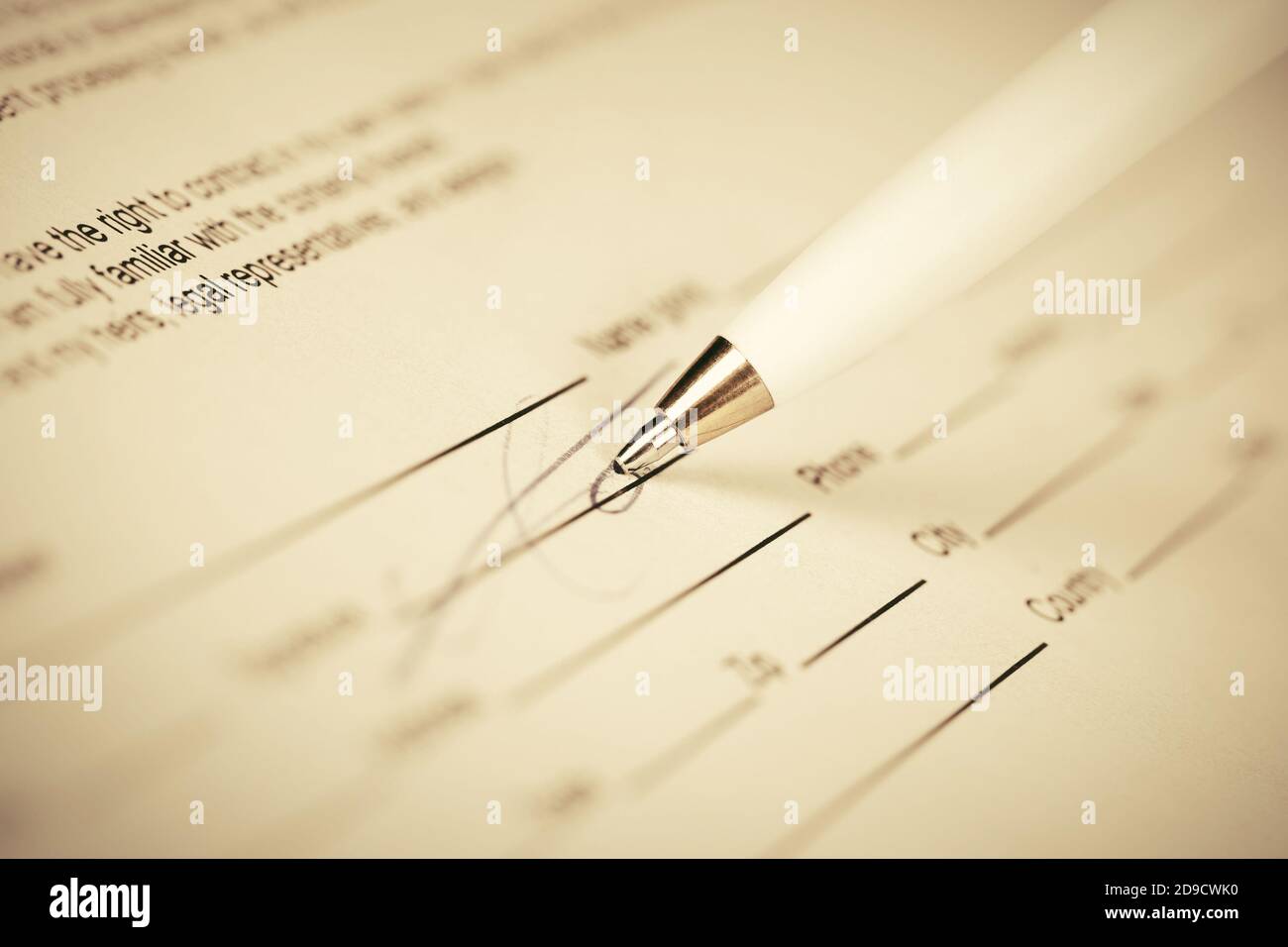 Close-up of signing contract pen over form Stock Photo - Alamy