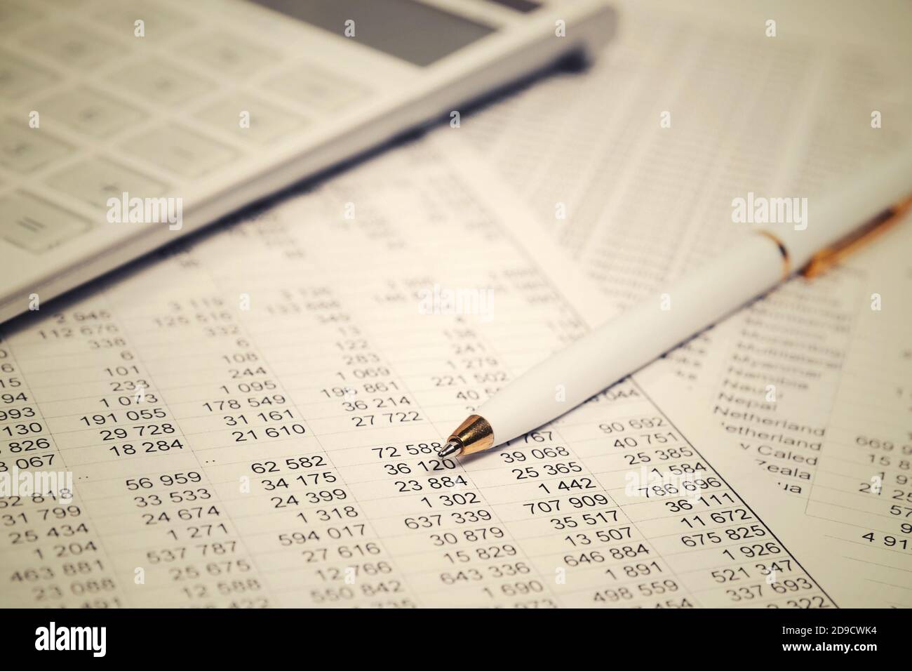 Financial accounting Pen and calculator on balance sheets Stock Photo ...