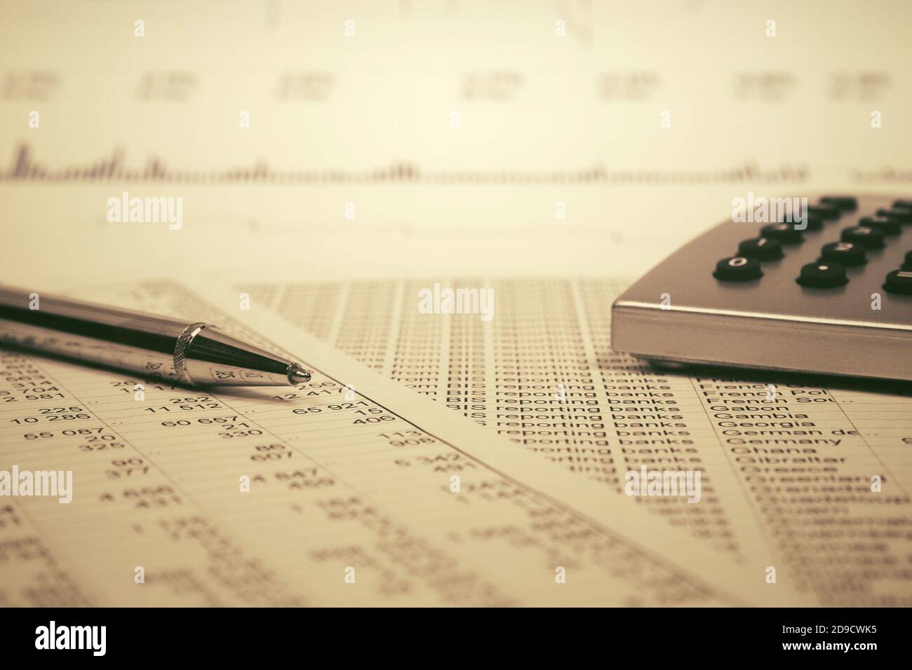 Financial accounting Pen and calculator on balance sheets Stock Photo ...
