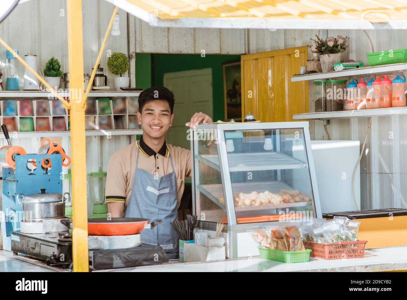 proud young asian man small business owner at his shop made of truck ...