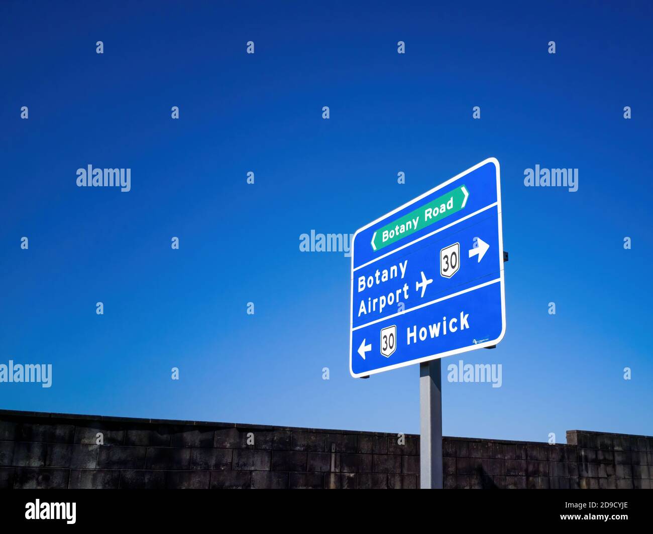 Blue information road sign showing directions Stock Photo - Alamy