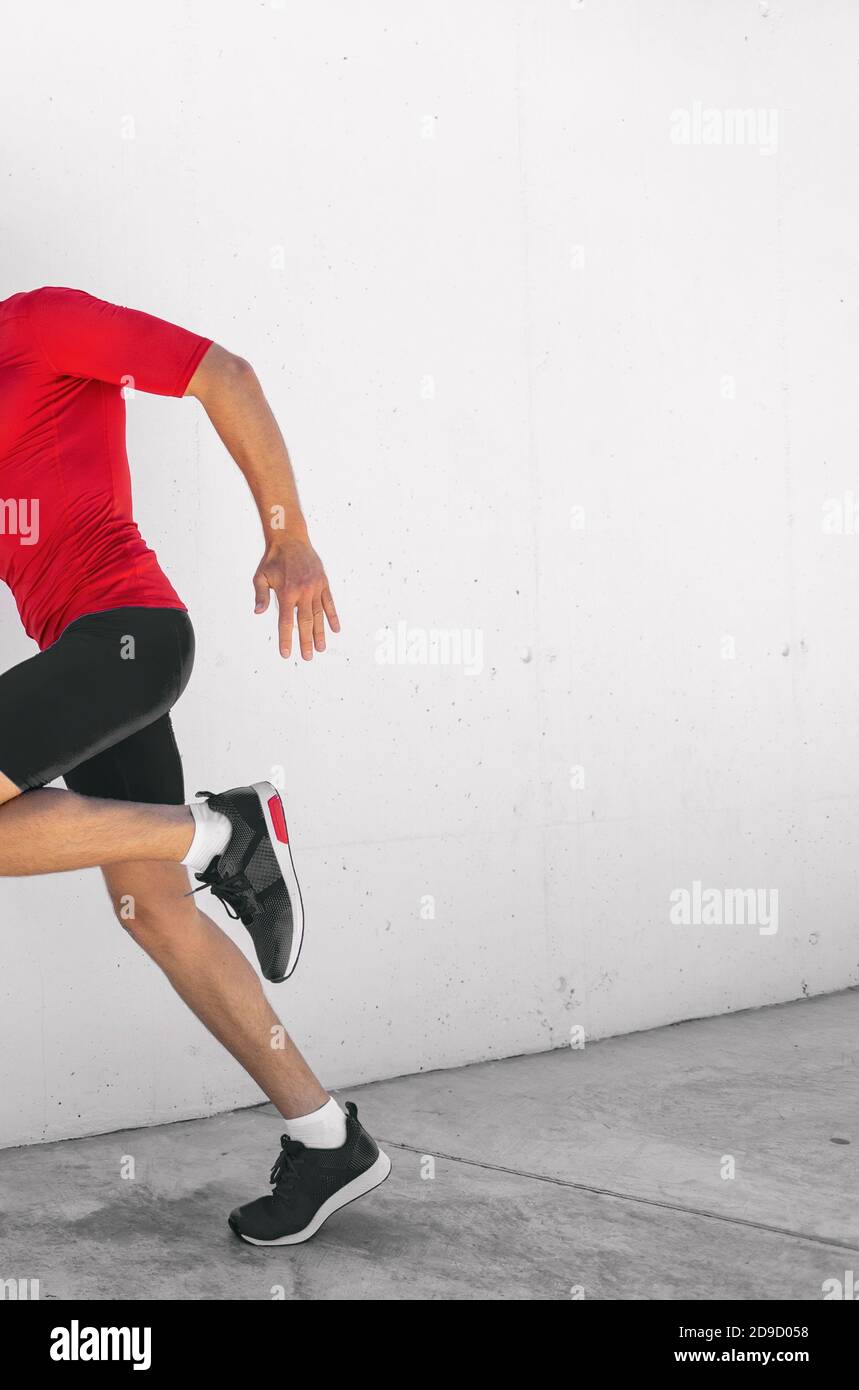 Running shoes runner athlete man jogging fast. Vertical crop of body ...