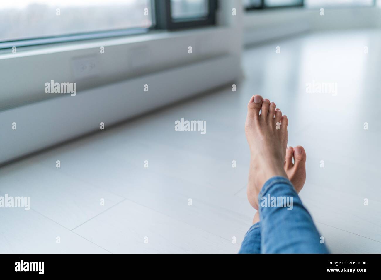 Woman relaxing apartment legs hi-res stock photography and images - Alamy