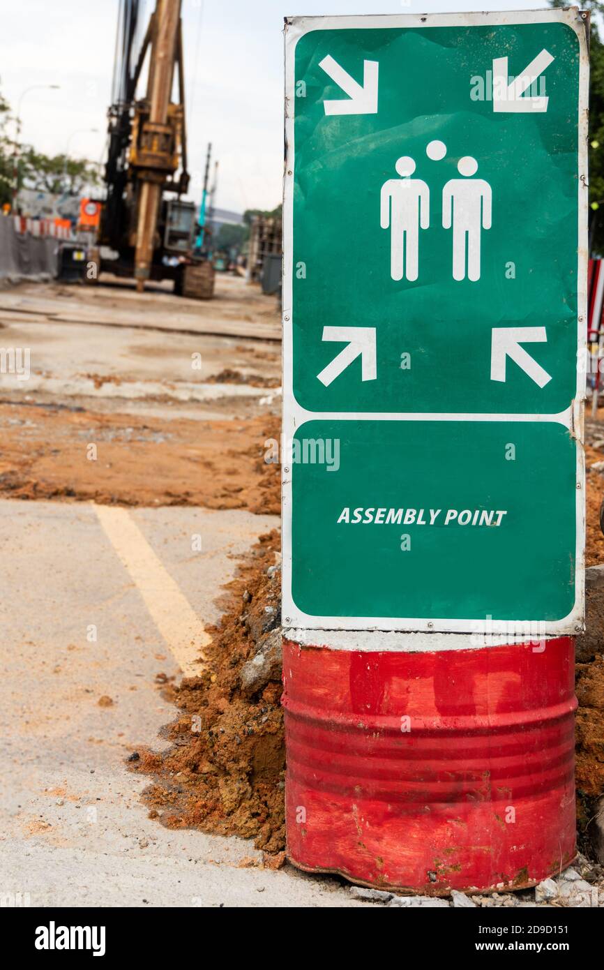 Assembly Point signage with construction site background Stock Photo ...