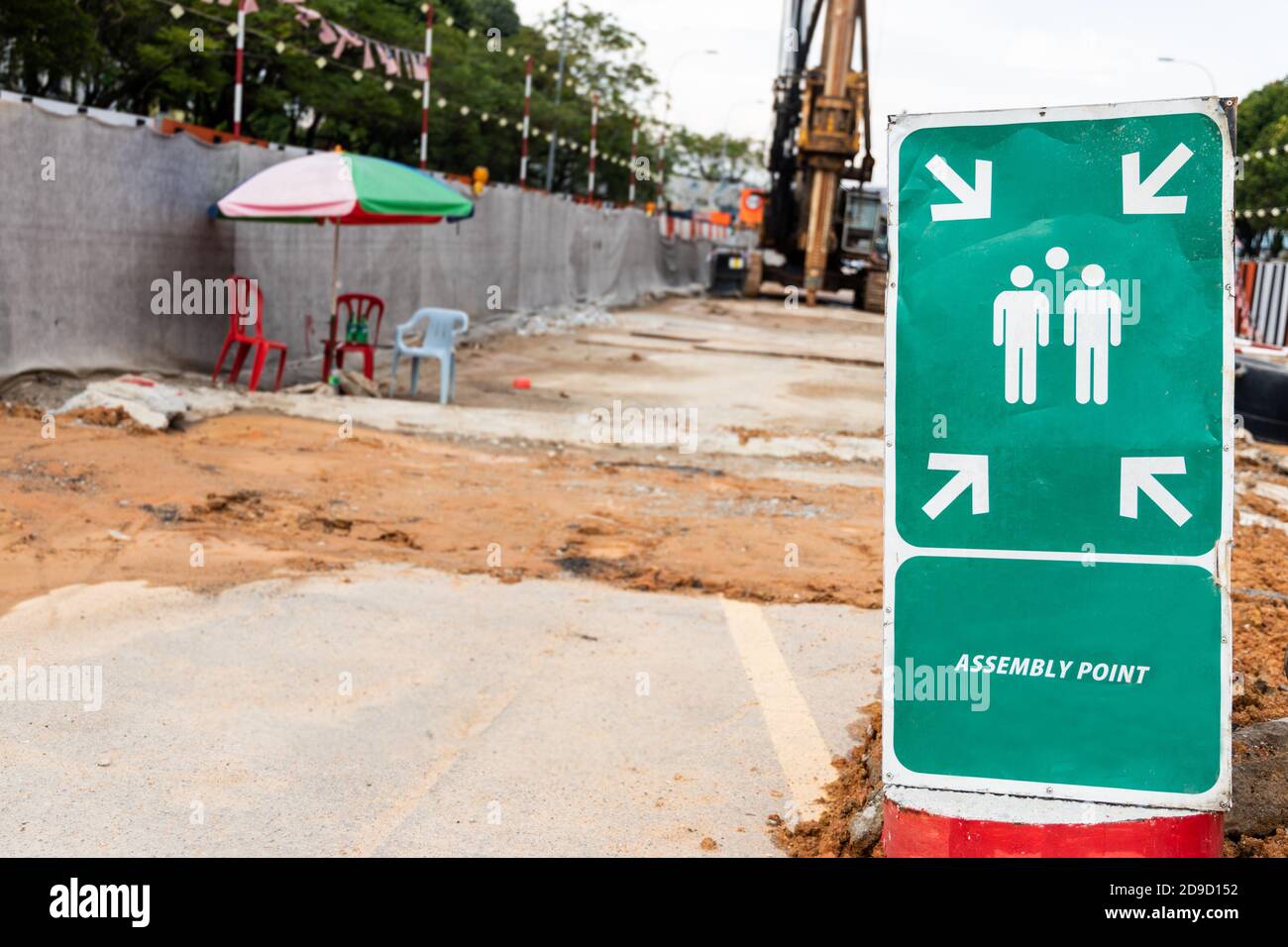 Assembly Point signage with construction site background Stock Photo ...