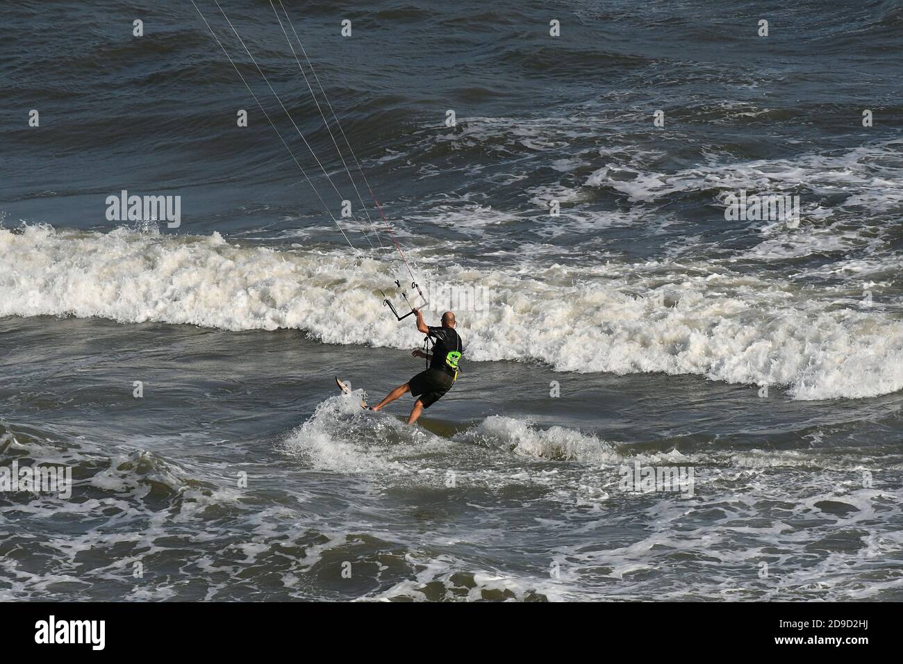 man para surfing in ocean of shore of South Carolina Stock Photo - Alamy