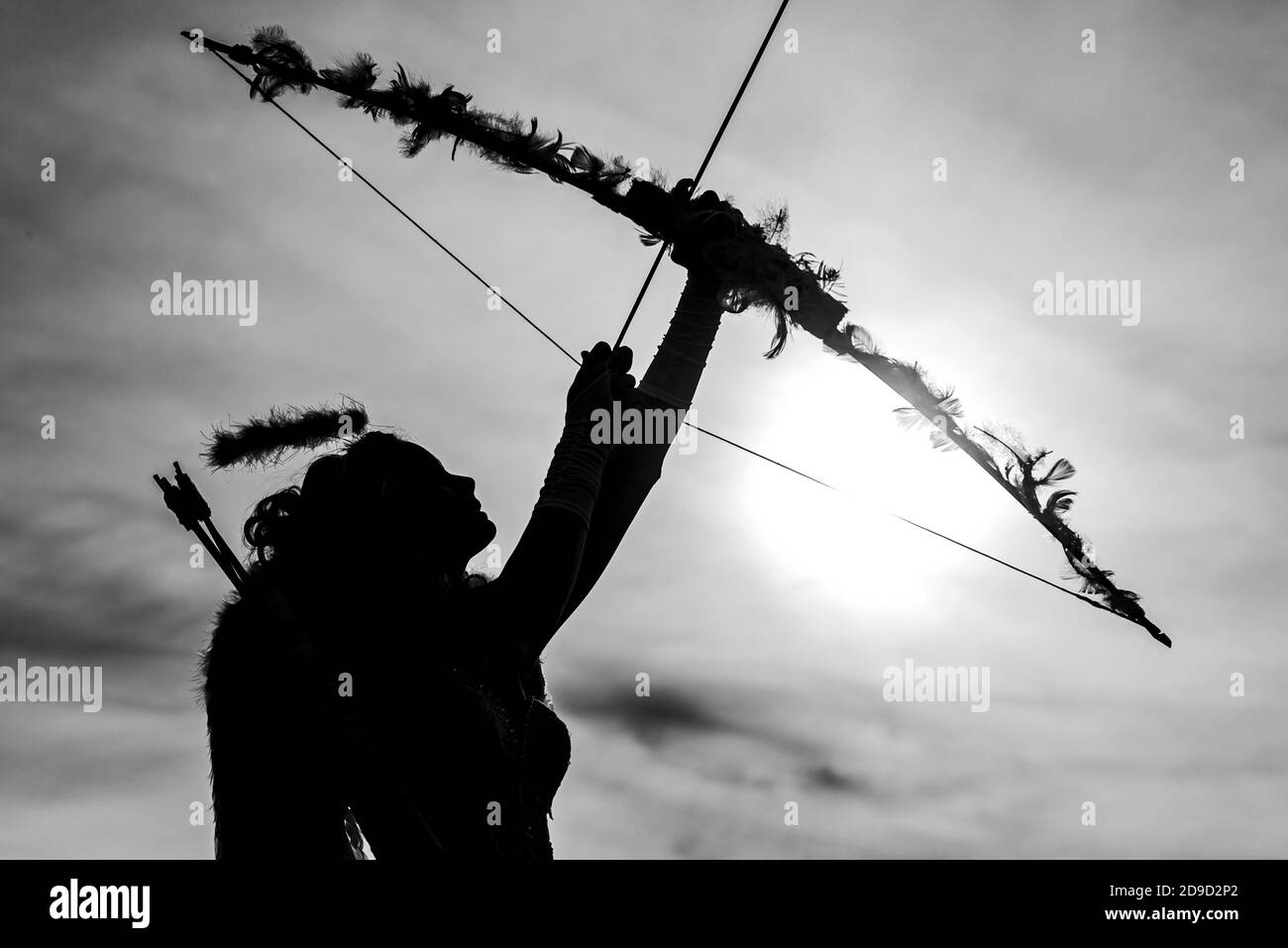 Little angel girl against sunny sky. Teen angel girl archer on sunset ...