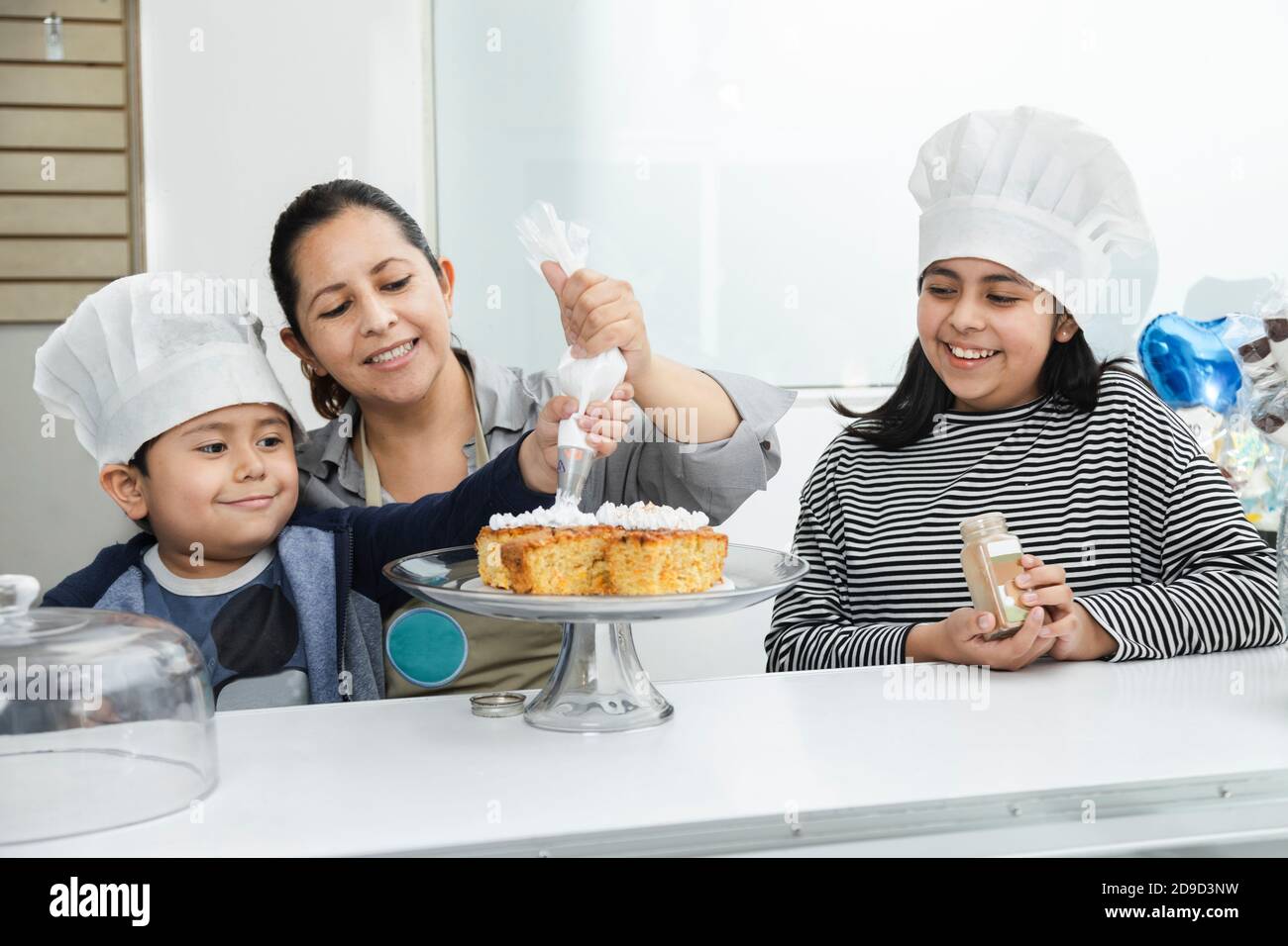 Mexican mother in kitchen hi-res stock photography and images - Alamy