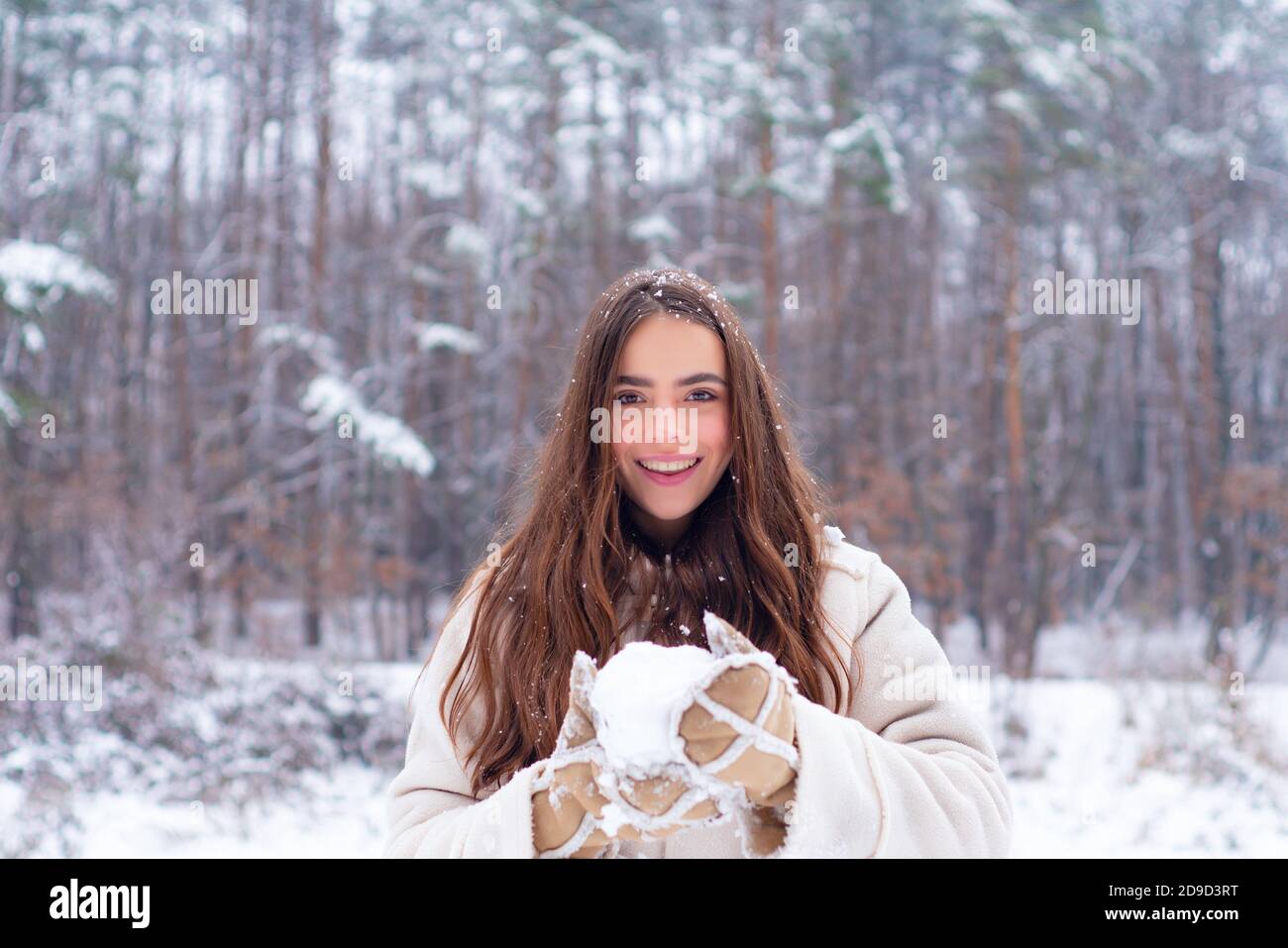 Snowing winter beauty fashion concept. Women in winter clothes. Outdoor ...