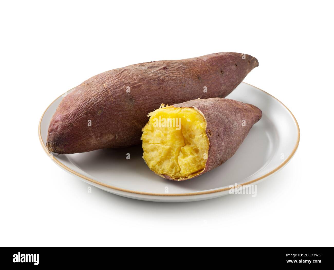 Sweet potatoes broken in half on a white background on a plate Stock ...