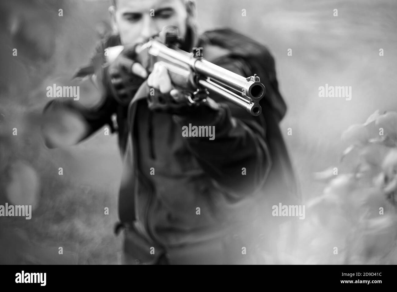 Hunting season. Hunter aiming rifle in forest. Barrel of a gun Stock ...