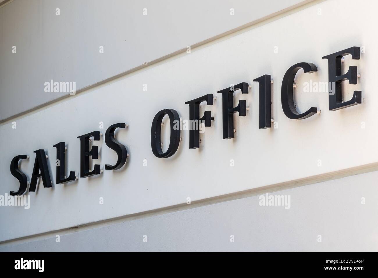 Sales office entrance with sign Stock Photo - Alamy