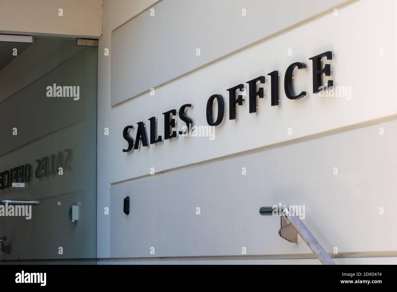 Sales office entrance with sign Stock Photo - Alamy