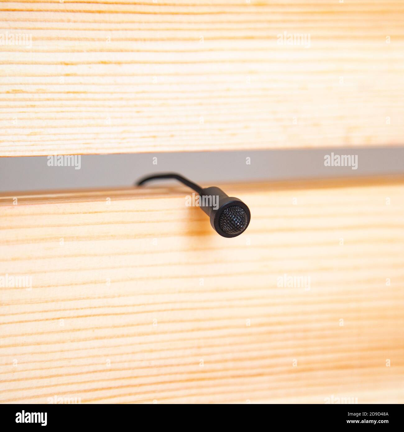 Installing a secret microphone for surveillance and espionage. Covered ...