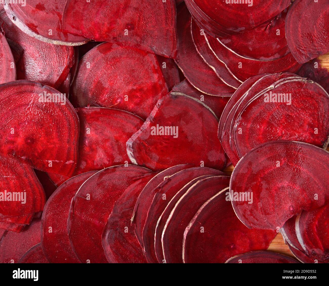 Background of thin sliced juicy red beets Stock Photo - Alamy