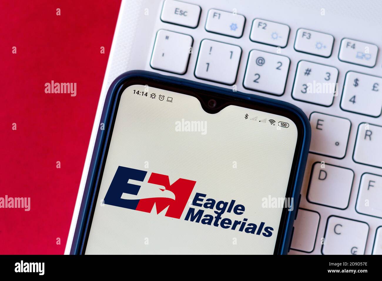 In this photo illustration the Eagle Materials logo seen displayed on a ...