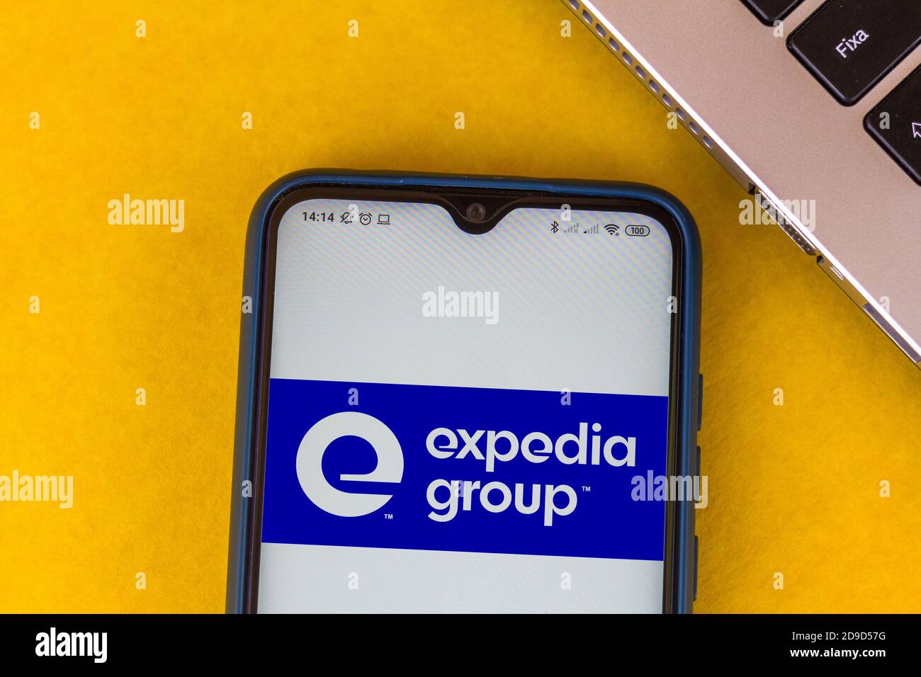 In this photo illustration the Expedia Group logo seen displayed on a ...