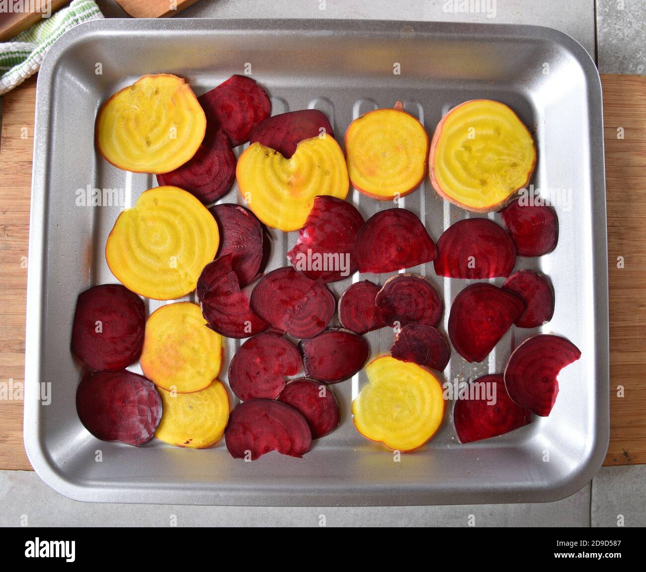 Overhead view of sliced golden and red beets in a baking pan Stock ...