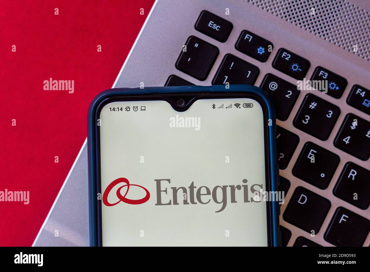 In this photo illustration the Entegris logo seen displayed on a ...