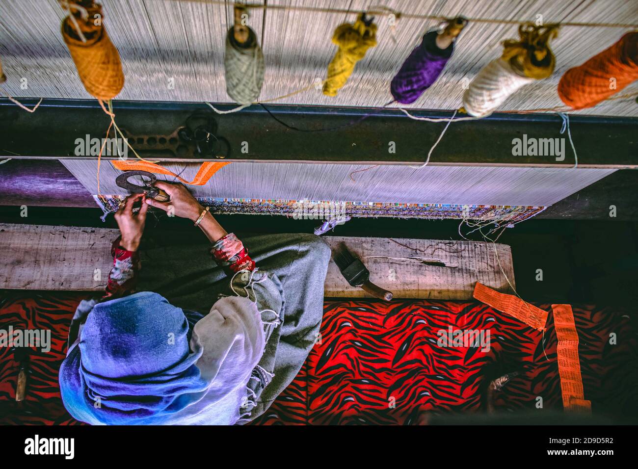 A woman weaving and making handloom items. kashmir, India Stock Photo ...