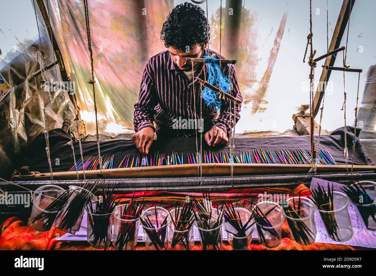 A woman weaving and making handloom items. kashmir, India Stock Photo ...