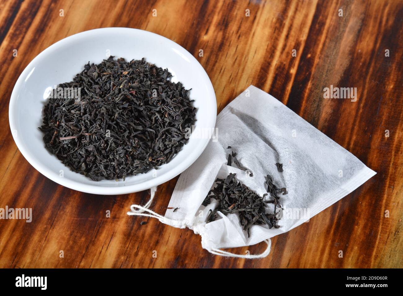 Whole leaf black tea and a tea bag Stock Photo - Alamy