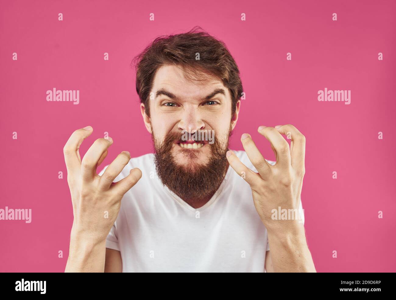 Angry man yells on pink background stress irritability model Stock ...