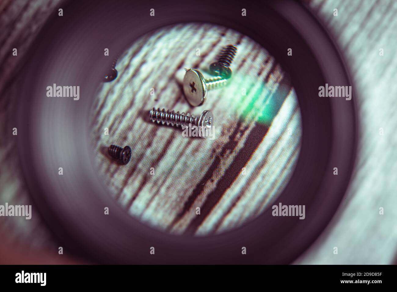 Some tiny screws on a loupe lens photographic glass unmade close up ...