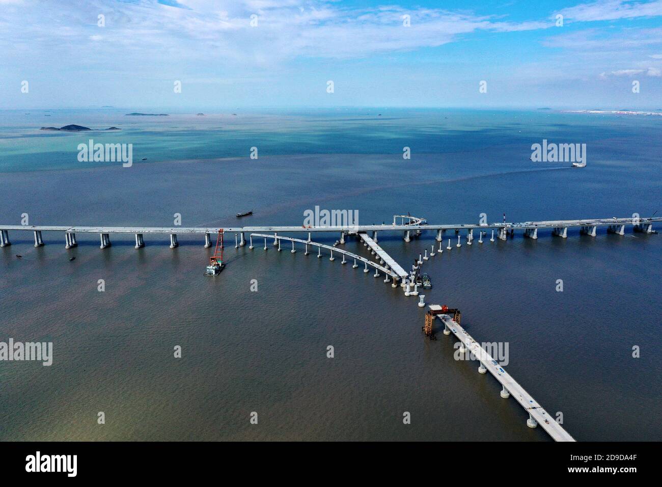 An aerial view of workers building the Zhoudai Bridge, which connect ...