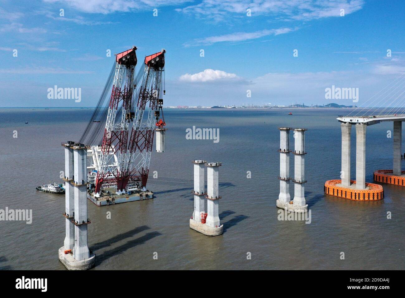 An aerial view of a crane working to build the Zhoudai Bridge, which ...