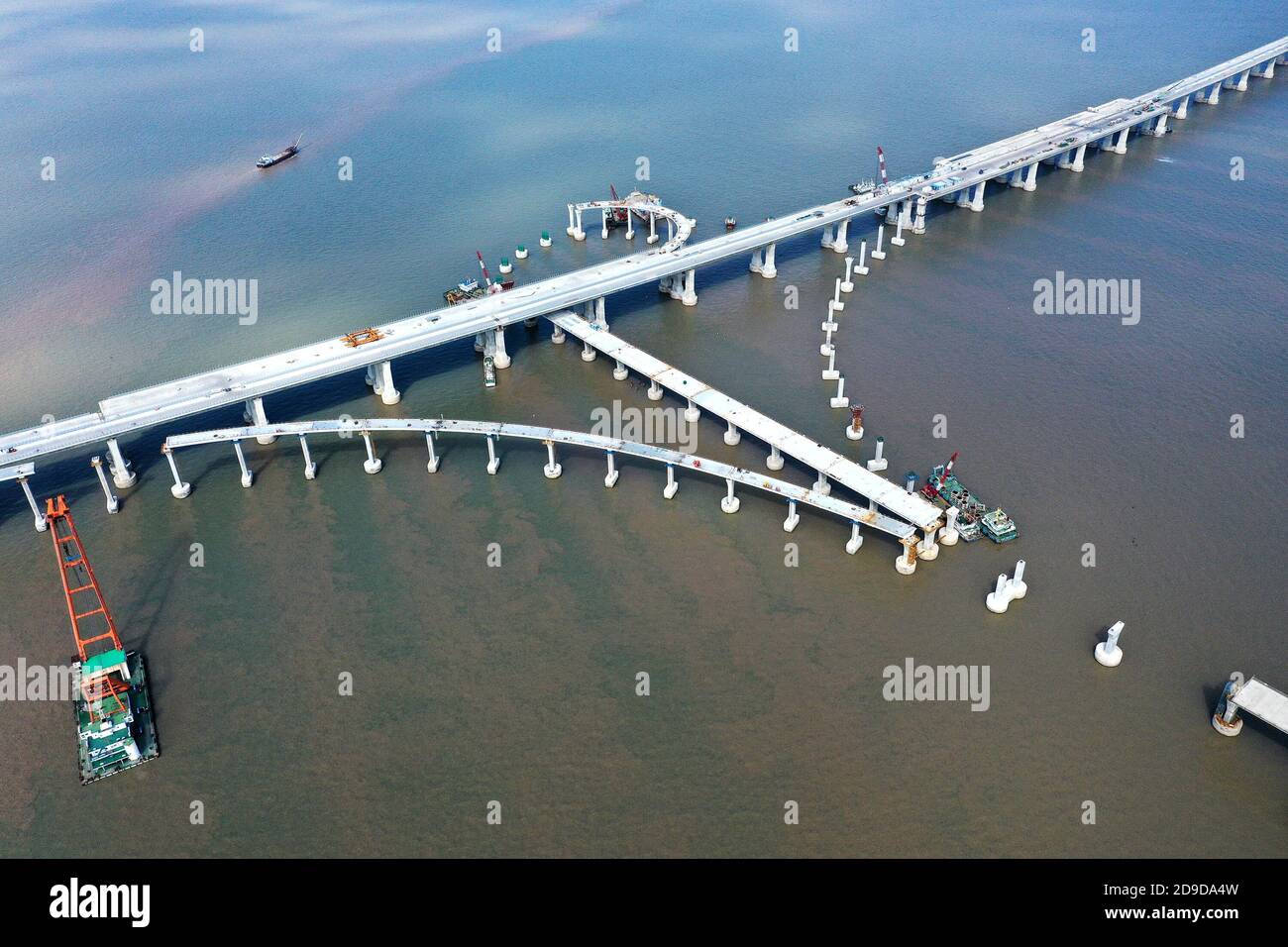 An aerial view of workers building the Zhoudai Bridge, which connect ...