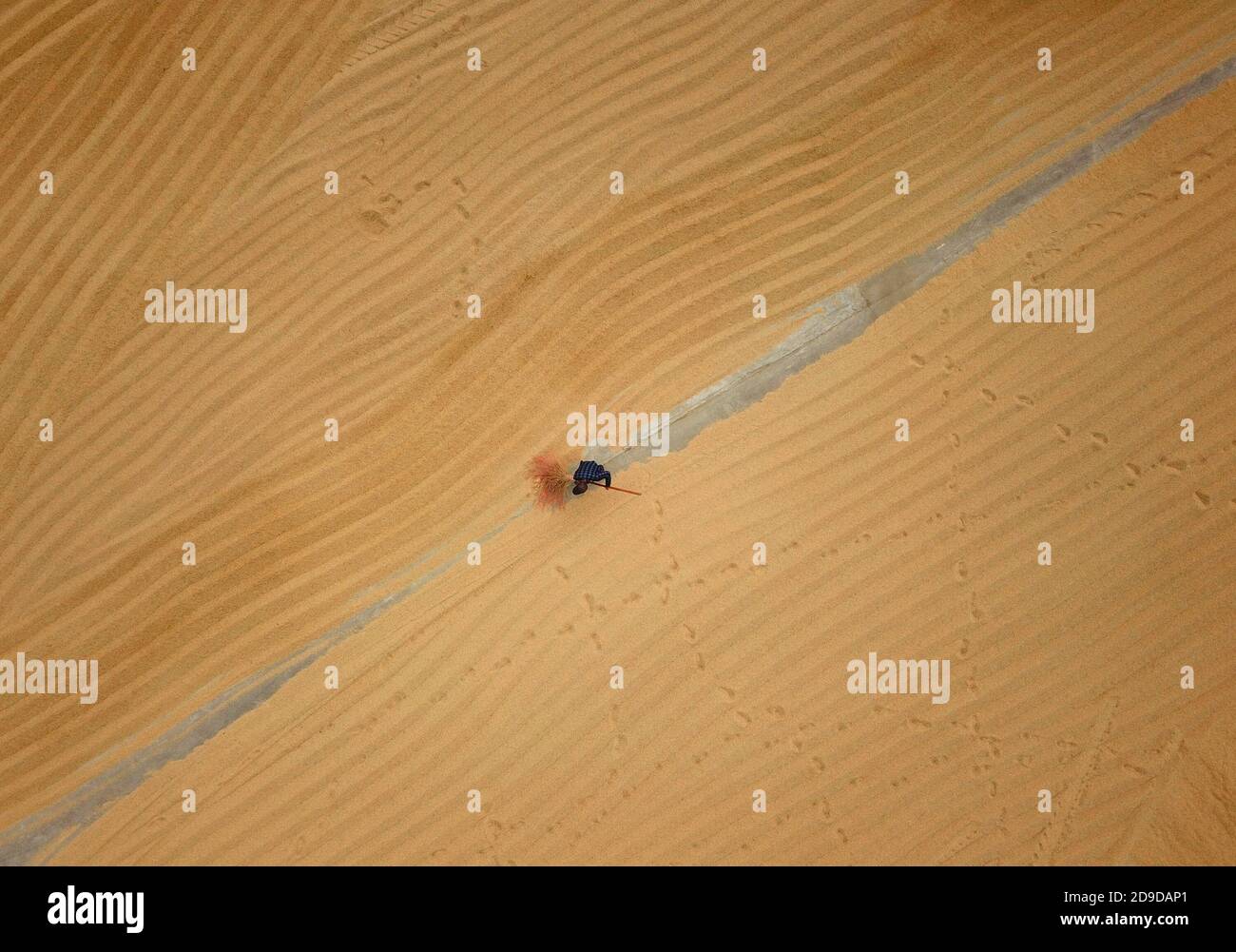 Aerial view of a farm, where farmers dry the paddy immediately after ...